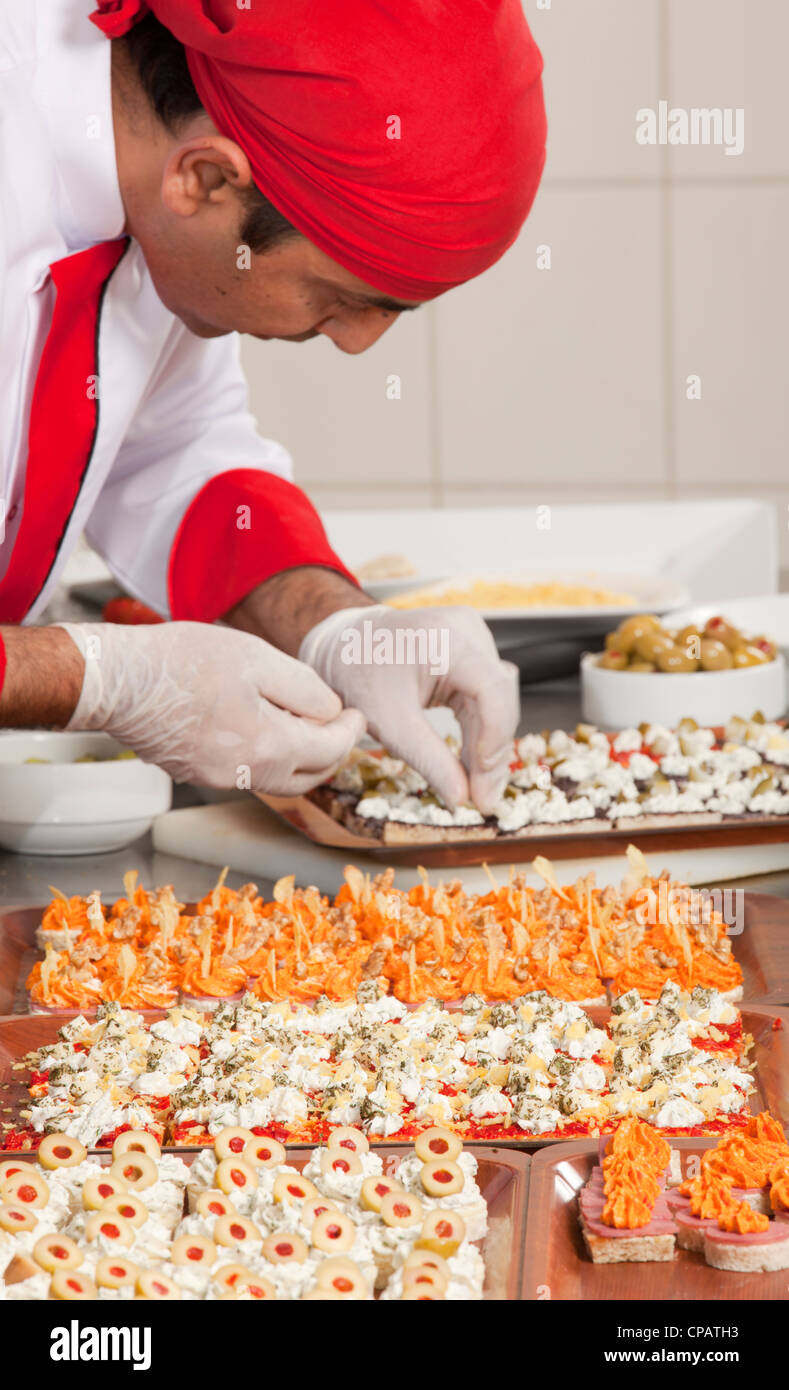 chef garnishing canapes Stock Photo - Alamy
