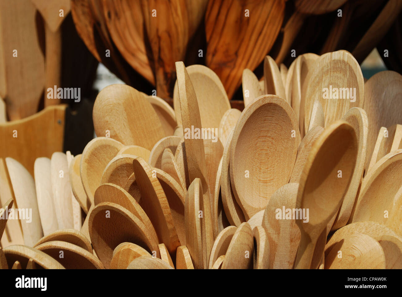 Group of wooden cooking spoons on sale at market as a background Stock ...