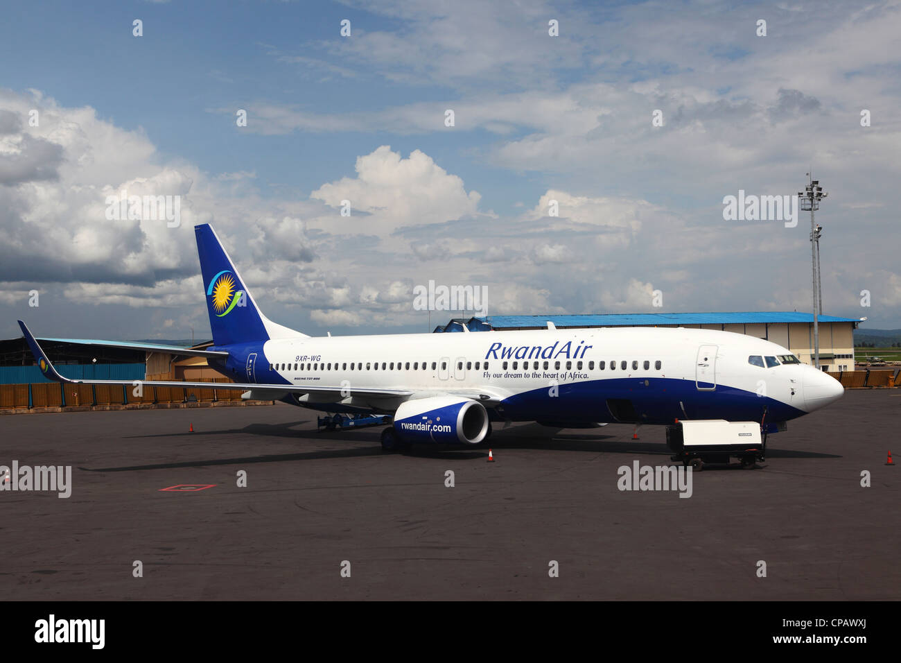 A RwandAir airliner on the tarmac at Kigali International Airport ...