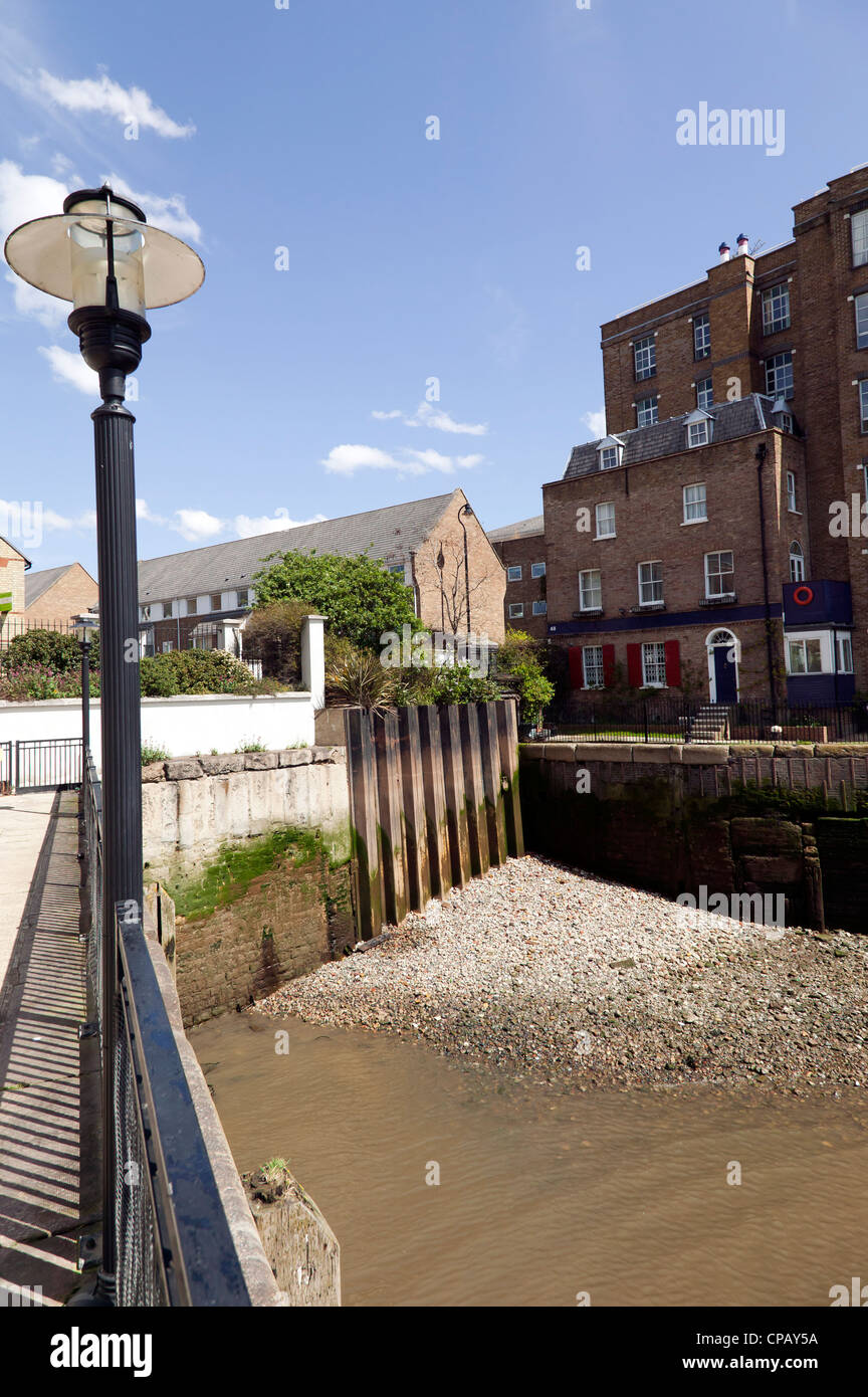Old wharf buildings seen from the Thames Path, just off Narrow Street ...