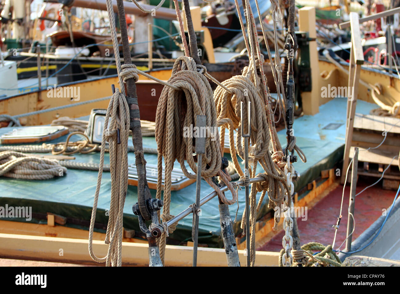 Close up of ropes hanging on the rigging of a boat Stock Photo - Alamy