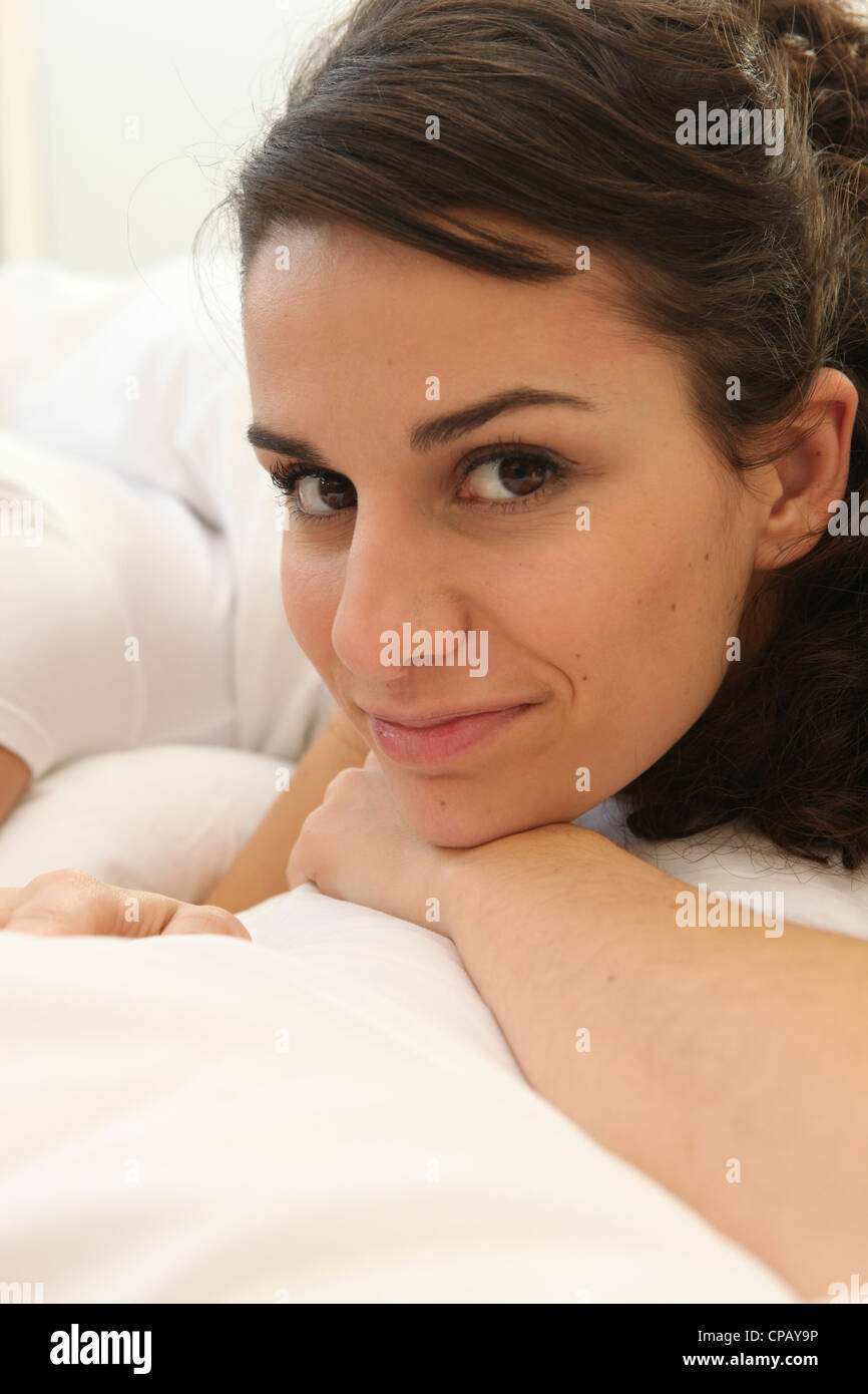 Woman slowly waking up Stock Photo - Alamy