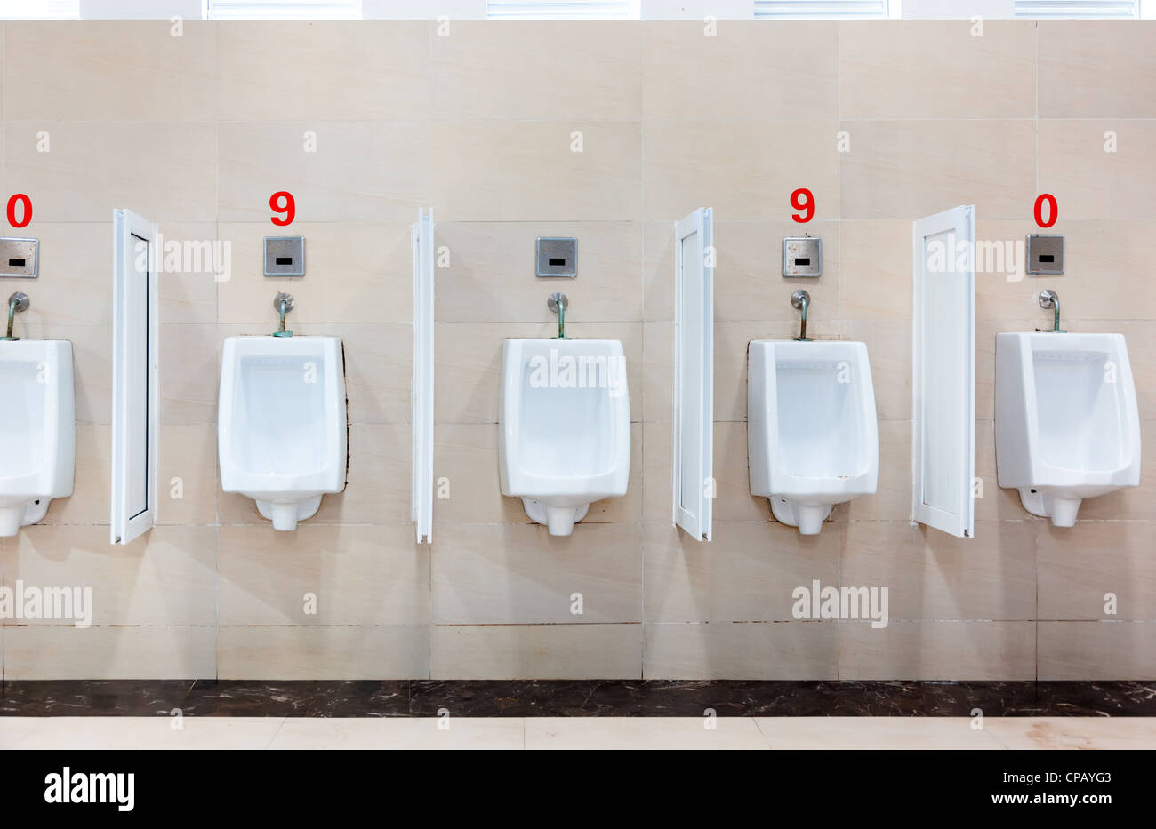 modern restroom interior with urinal row Stock Photo - Alamy