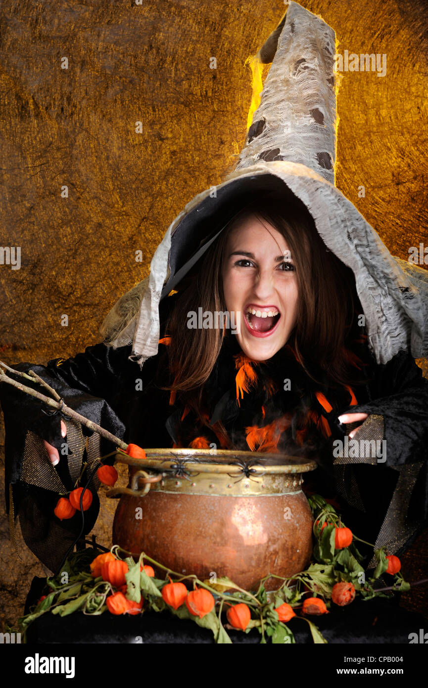 halloween witch cooking in a copper,screaming Stock Photo - Alamy