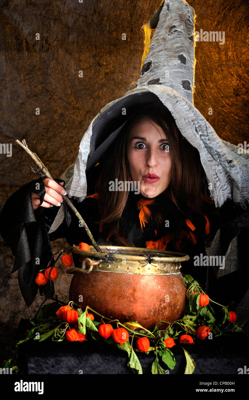 halloween witch cooking in a copper boiler Stock Photo - Alamy