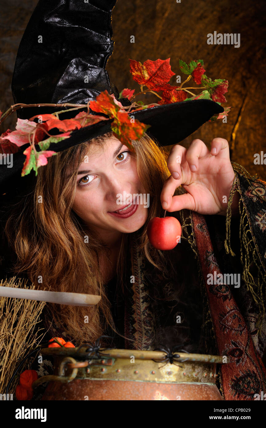 halloween witch cooking in a copper boiler Stock Photo - Alamy