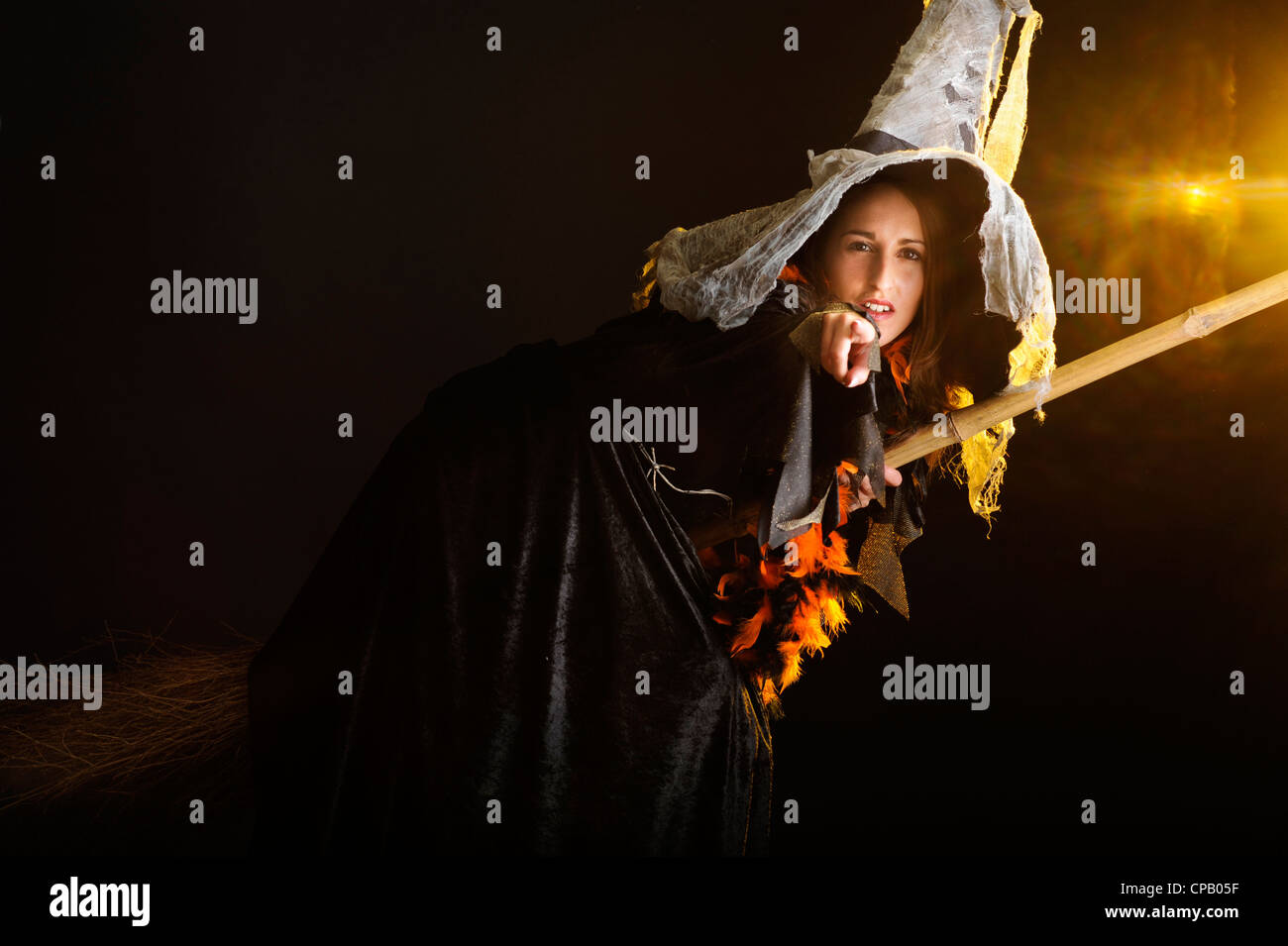 Witch on broom hi-res stock photography and images - Alamy