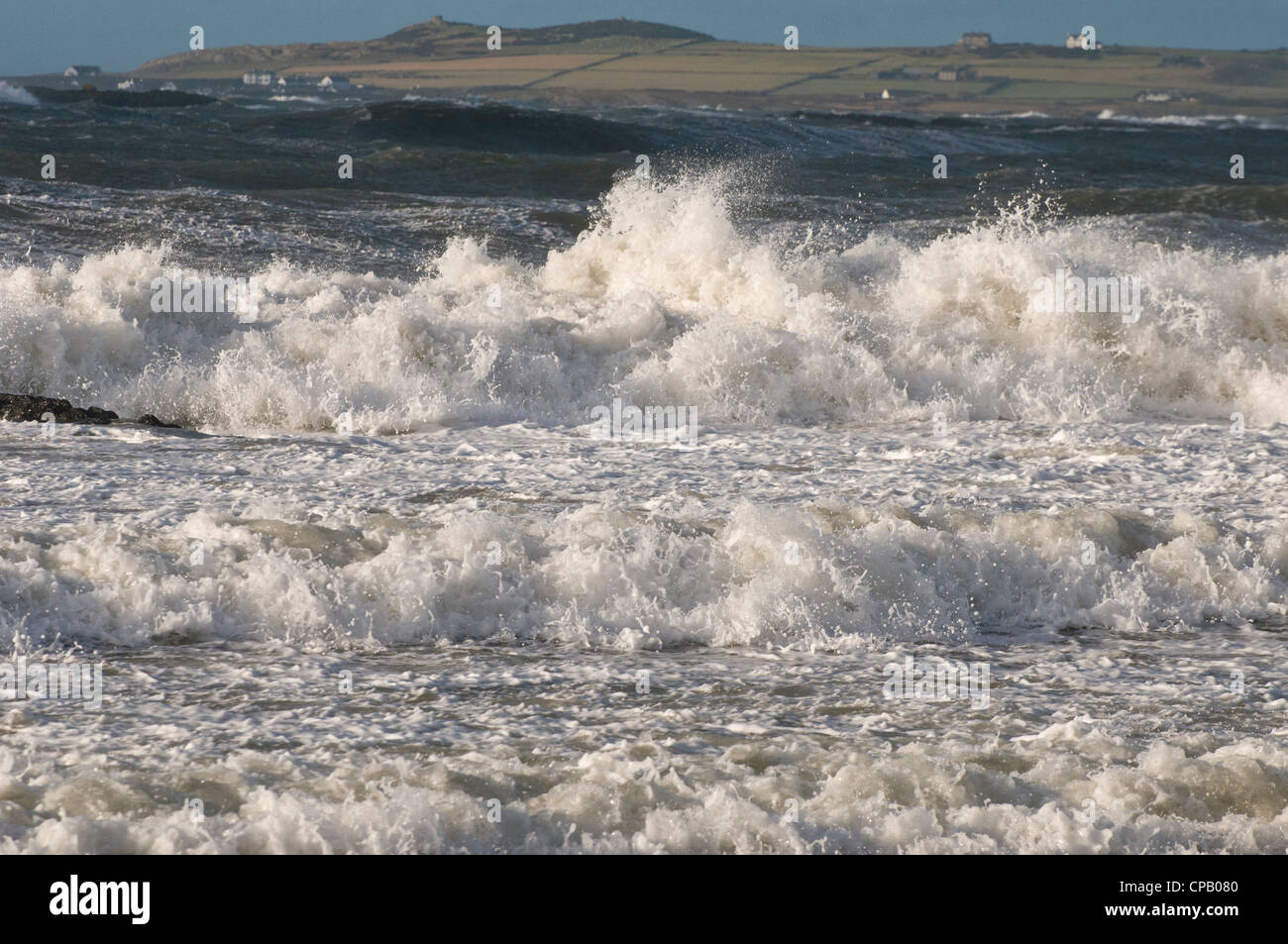 Rhosneiger rough sea surf Anglesey North Wales Uk Stock Photo - Alamy