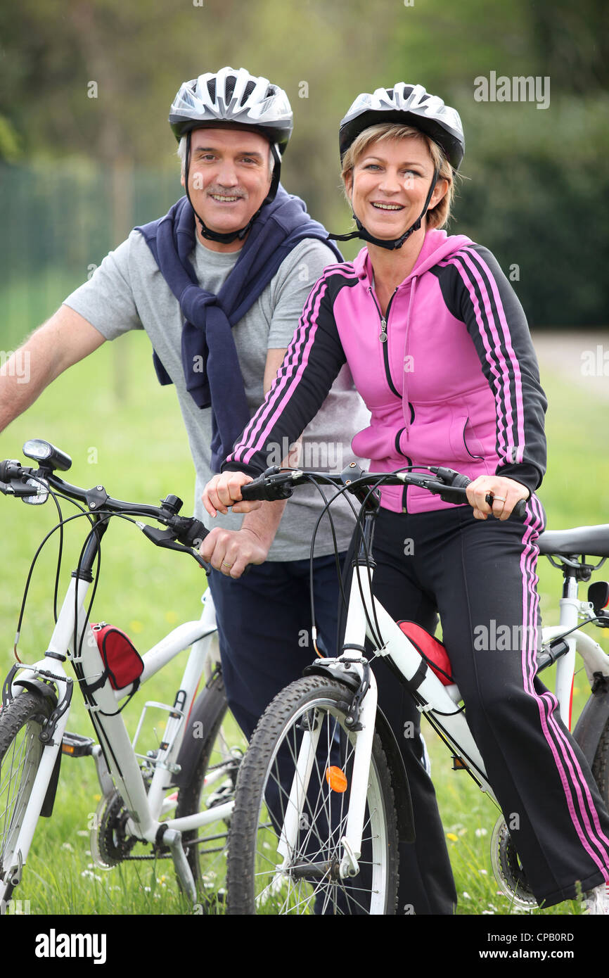 Couple having a bike ride Stock Photo - Alamy