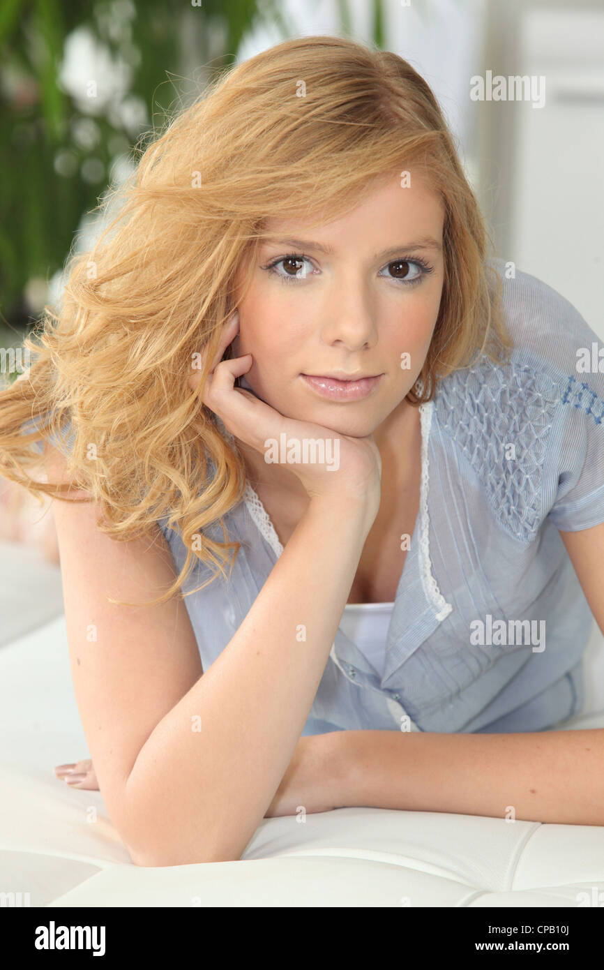 Bored women laying on her bed Stock Photo - Alamy
