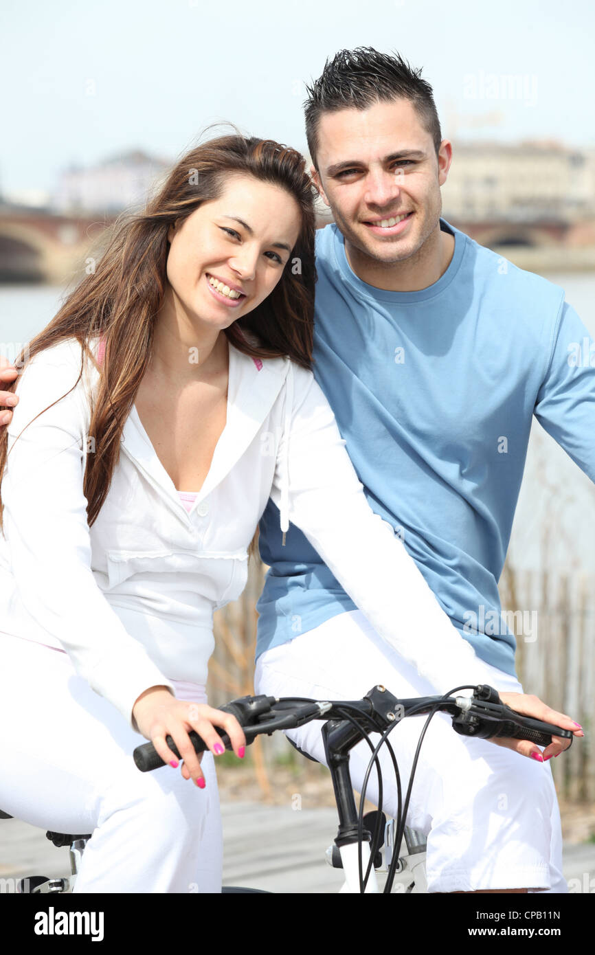 a couple doing bike Stock Photo - Alamy
