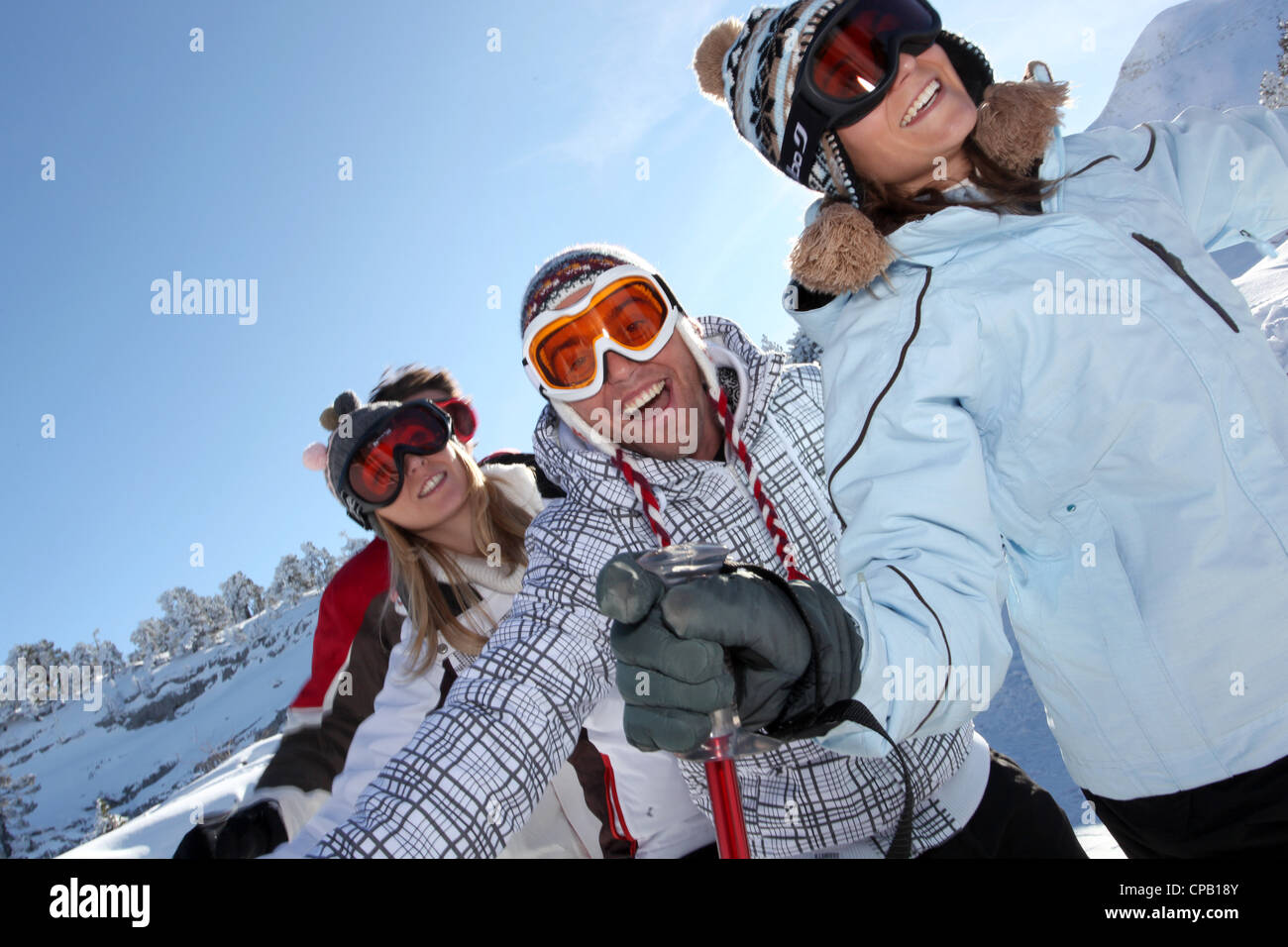 Friends skiing together Stock Photo - Alamy
