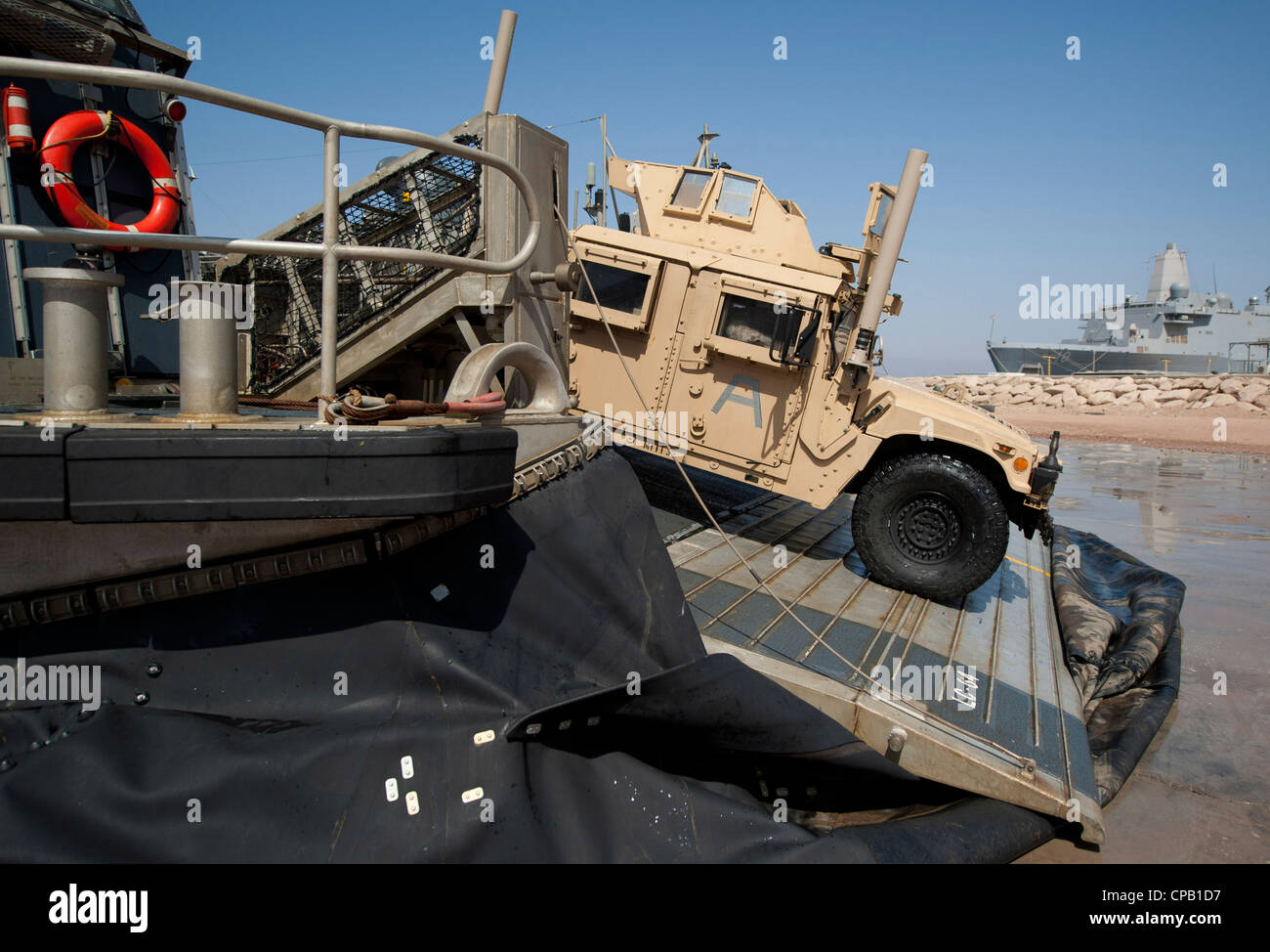 A Humvee debarks a landing craft air cushion assigned to Assault Craft ...