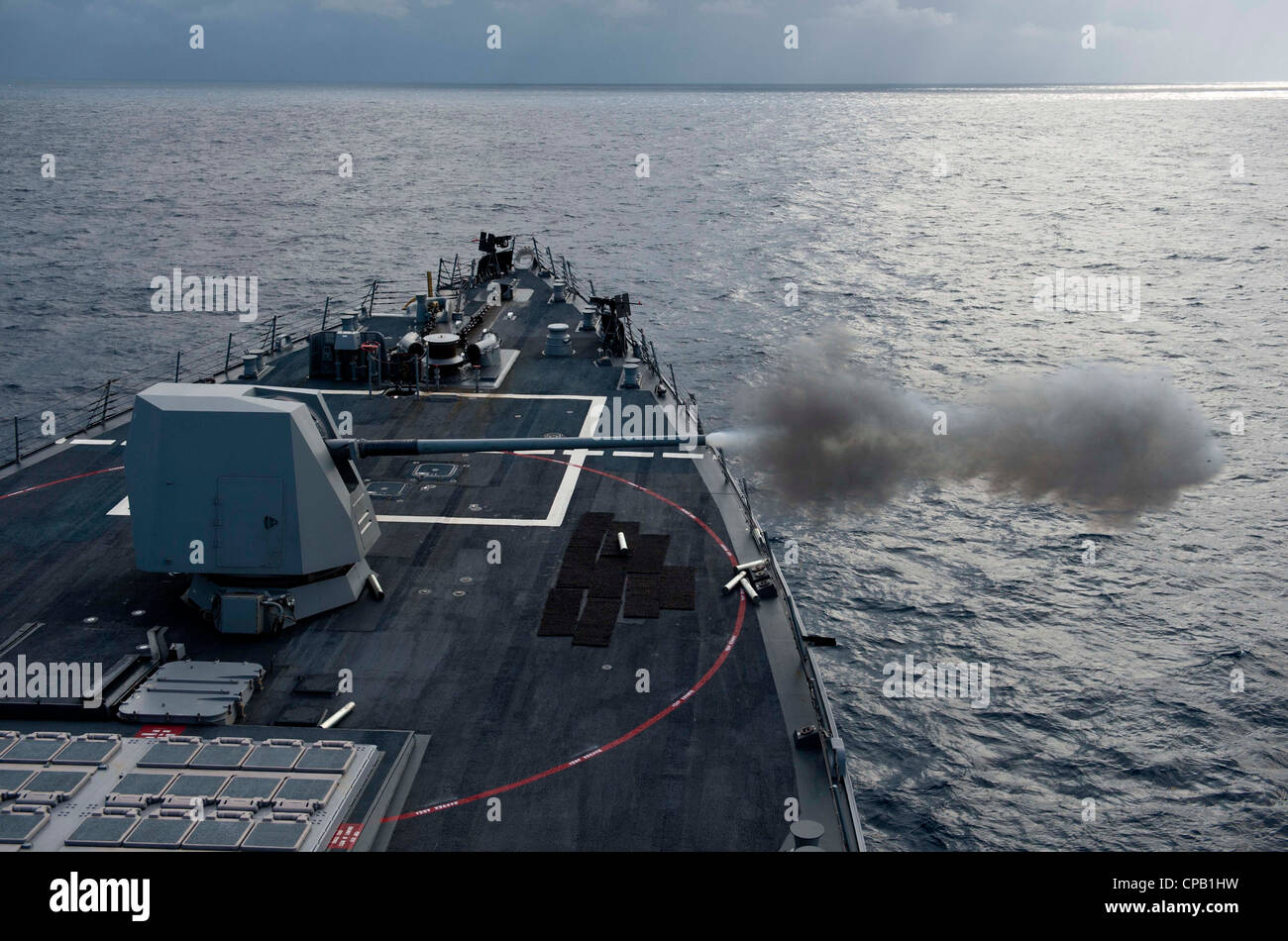 The guided-missile destroyer USS Jason Dunham (DDG 109) fires its MK-45 ...