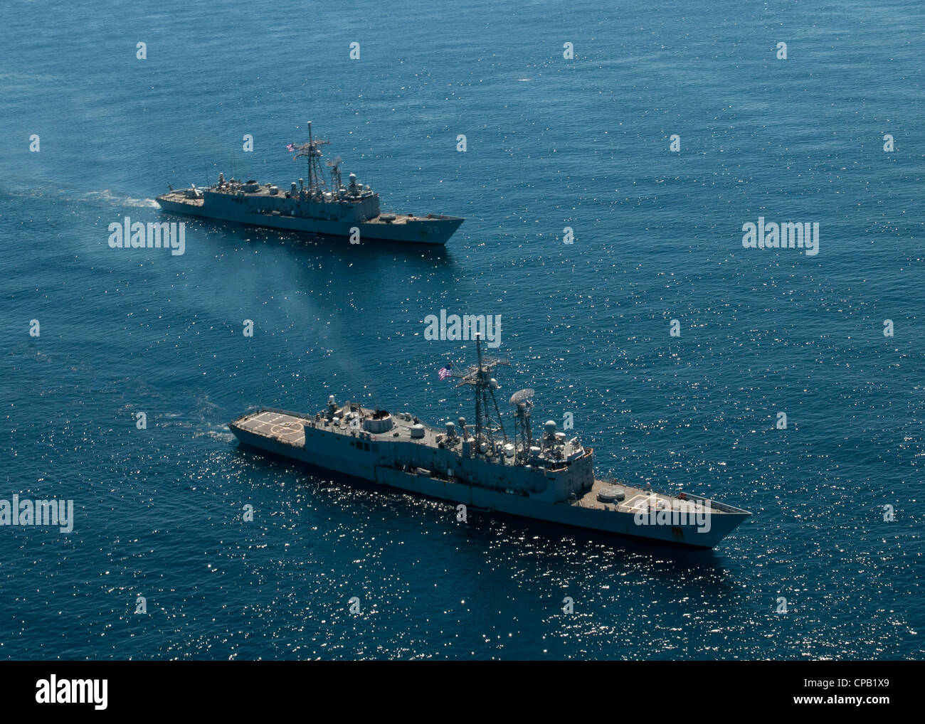 The guided-missile frigate USS Nicholas (FFG 47) conducts a passing ...