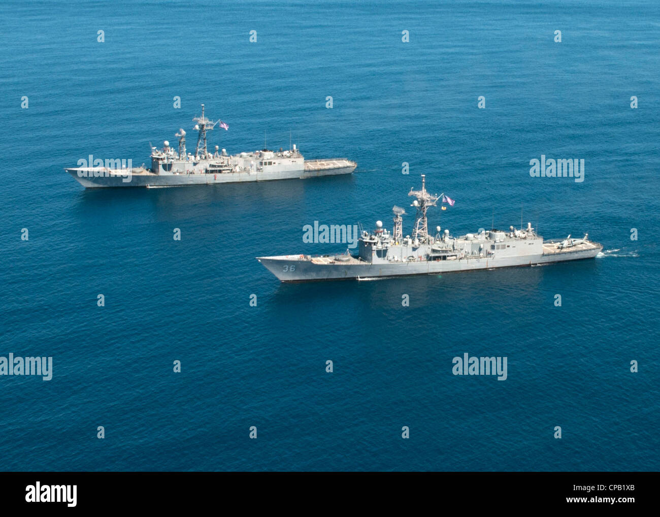 The guided-missile frigate USS Nicholas (FFG 47) conducts a passing ...