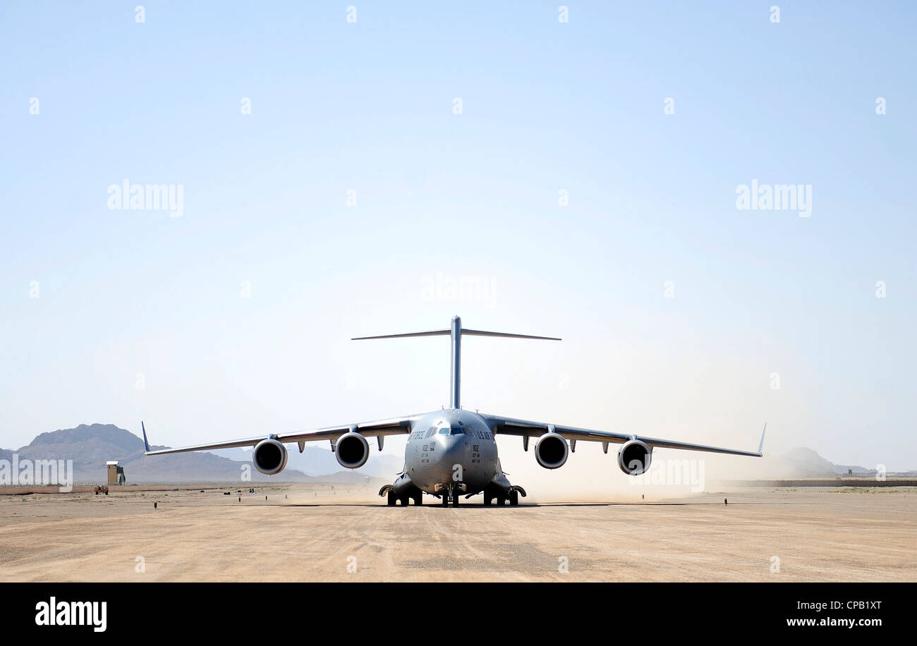 A U.S. Air Force C-17 "Globemaster III" cargo plane lands at the airfileld on Forward Operating ...