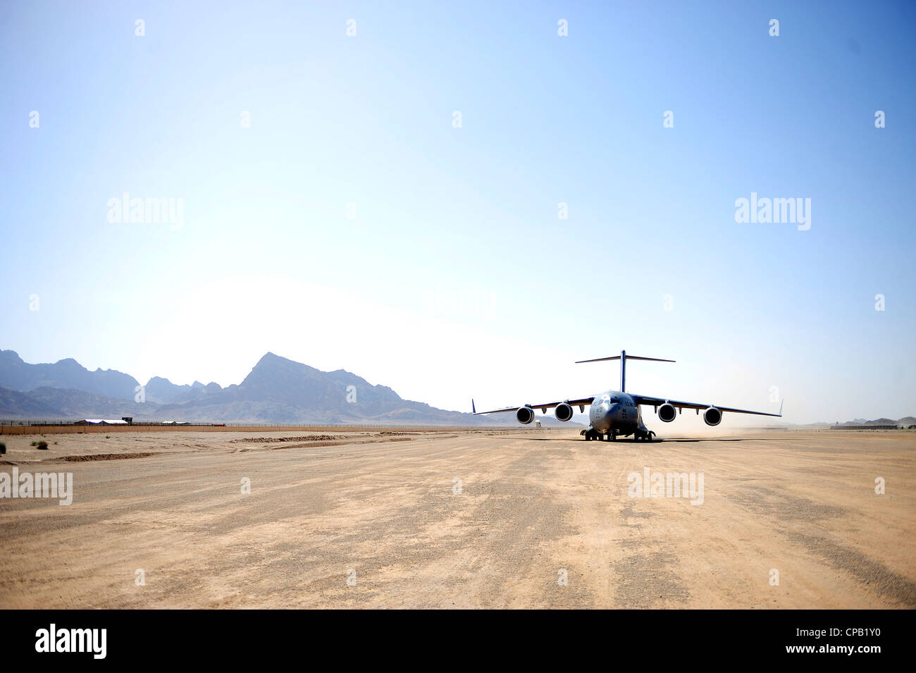 A U.S. Air Force C-17 "Globemaster III" cargo plane lands at the airfileld on Forward Operating ...