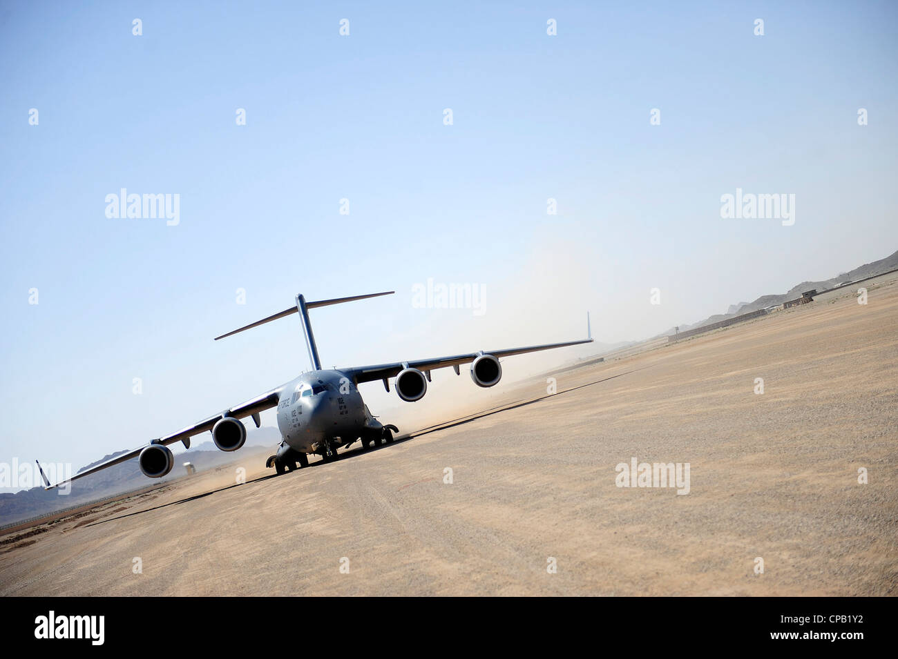 A U.S. Air Force C-17 "Globemaster III" cargo plane lands at the airfileld on Forward Operating ...