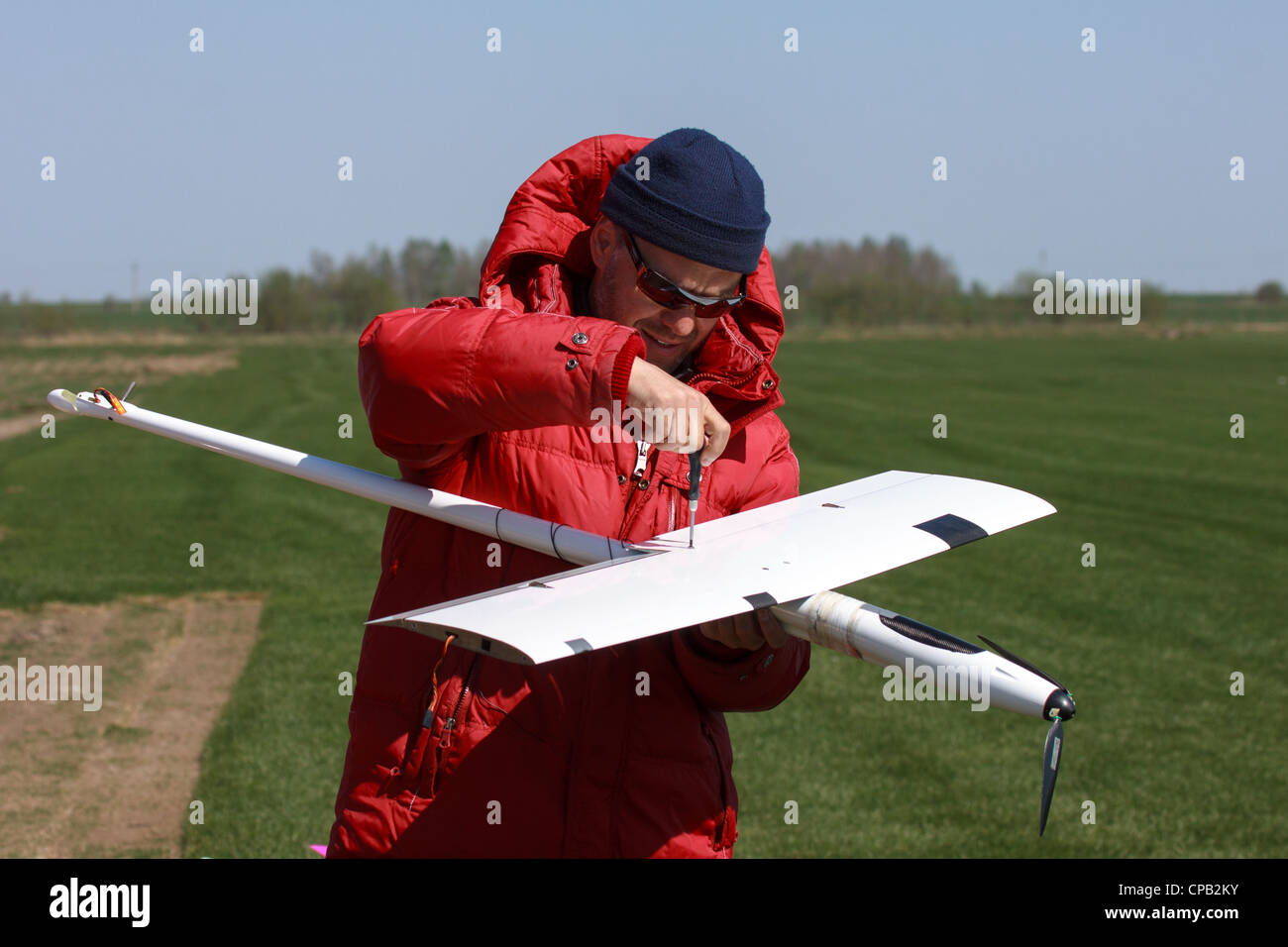 Man makes the assembly RC glider Stock Photo - Alamy