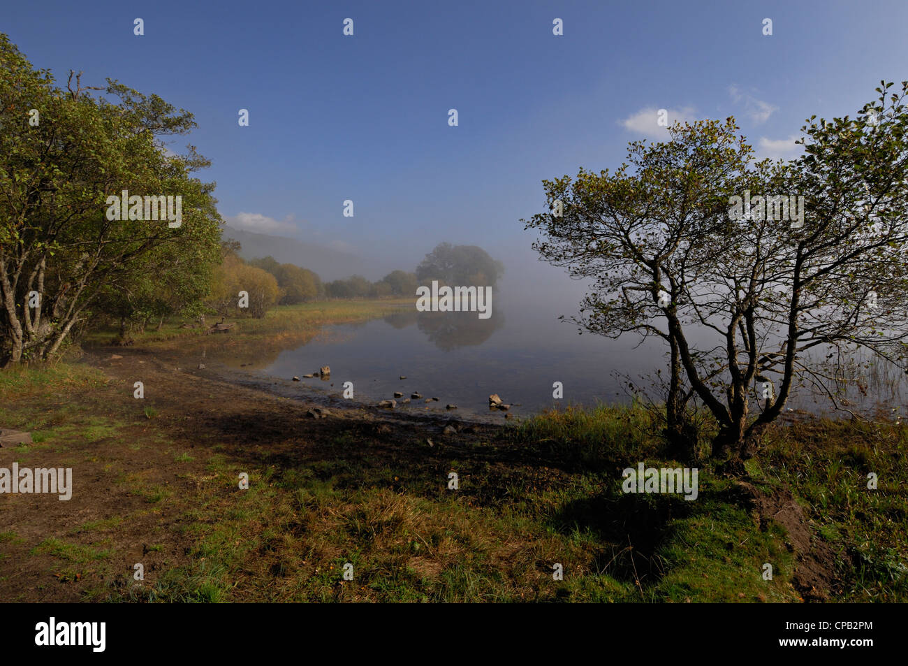 A misty, sunny day in September along the western shores of Loch Tay ...