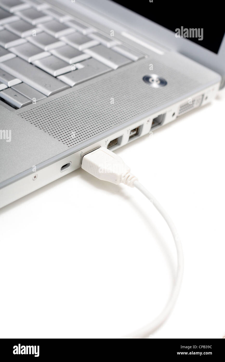 Laptop connected to a USB plug Stock Photo - Alamy
