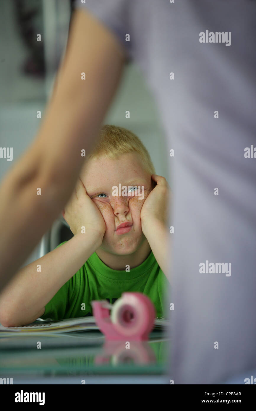 little boy in the classroom looking bored Stock Photo - Alamy