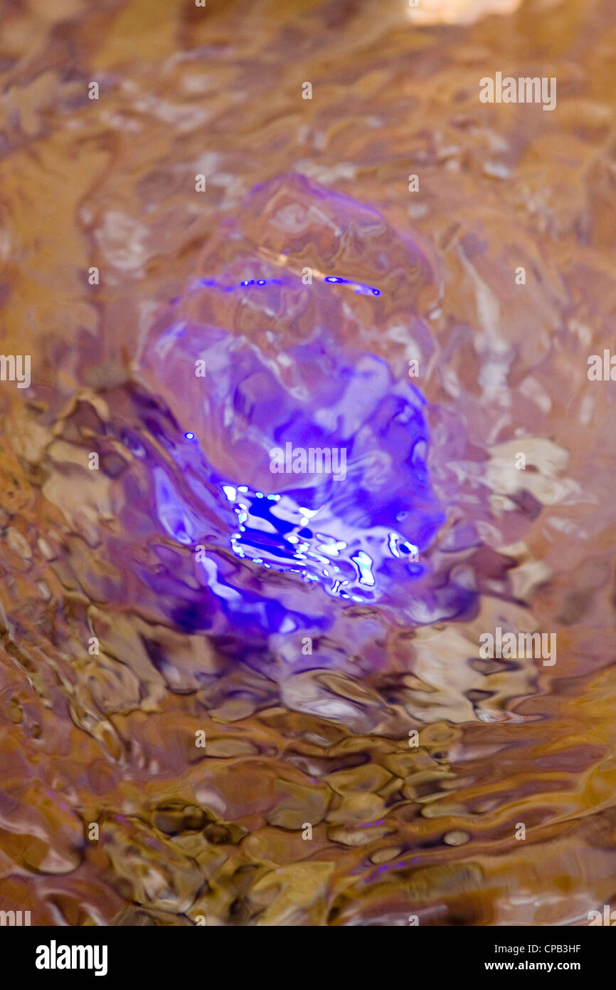 Water Feature patterns with a blue light Stock Photo - Alamy