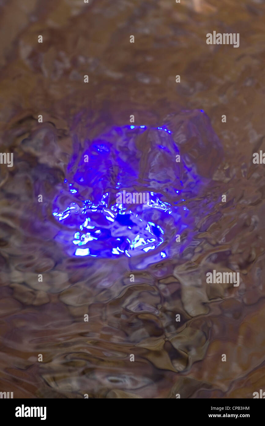 Water Feature patterns with a blue light Stock Photo - Alamy