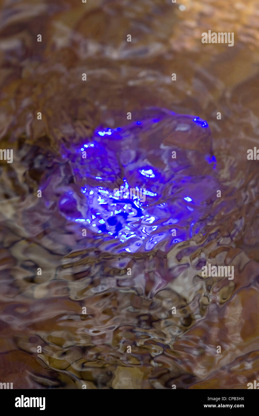 Water Feature patterns with a blue light Stock Photo - Alamy