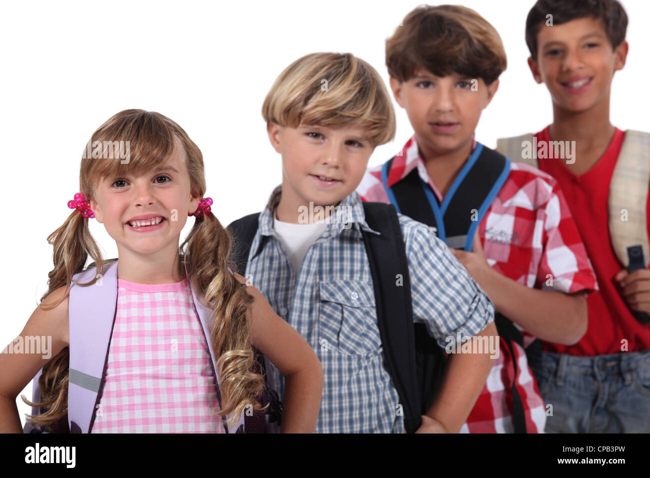 Row of happy primary school children hi-res stock photography and ...