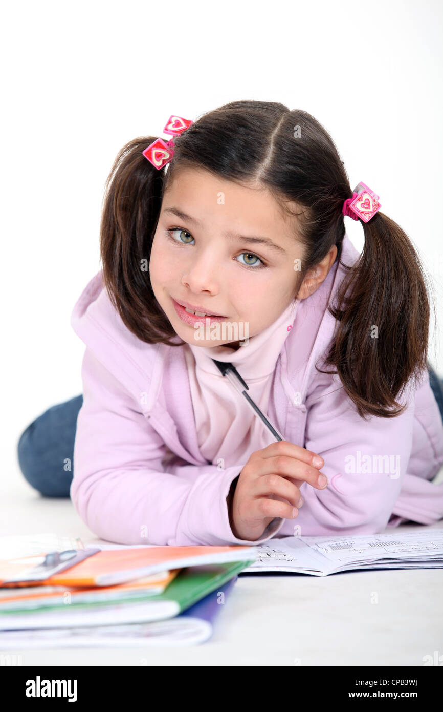 Little girl doing schoolwork Stock Photo - Alamy