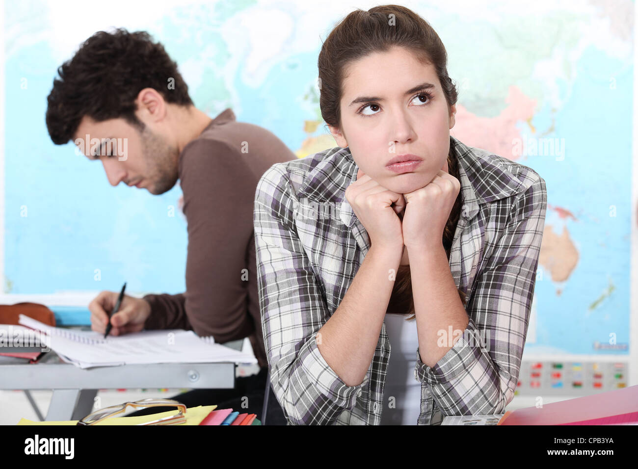 Stressed girl in class Stock Photo - Alamy