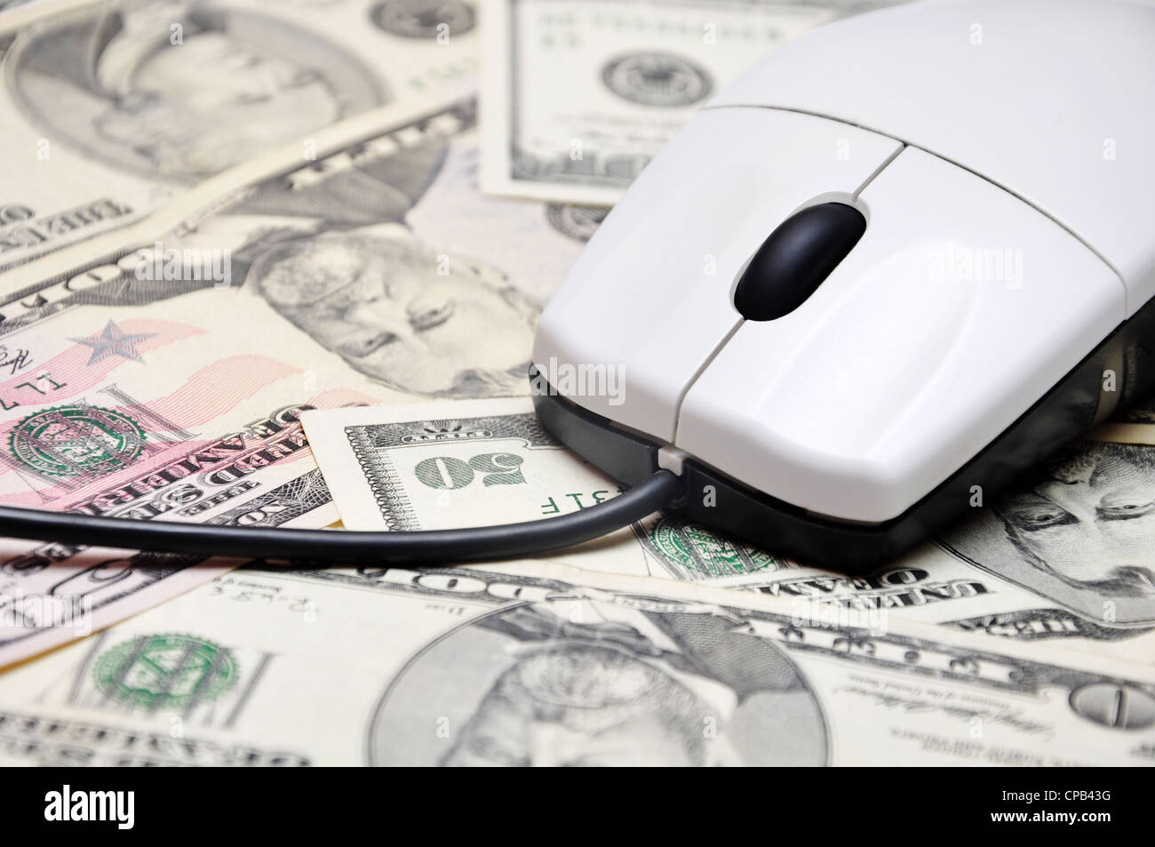 computer mouse on dollars banknotes background. E-commerce concept ...