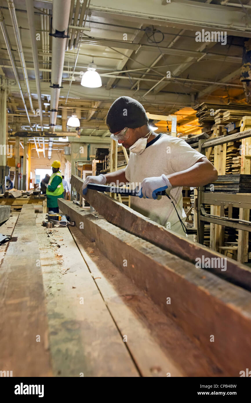 Workers Recycle Building Materials Salvaged from Deconstruction of a ...
