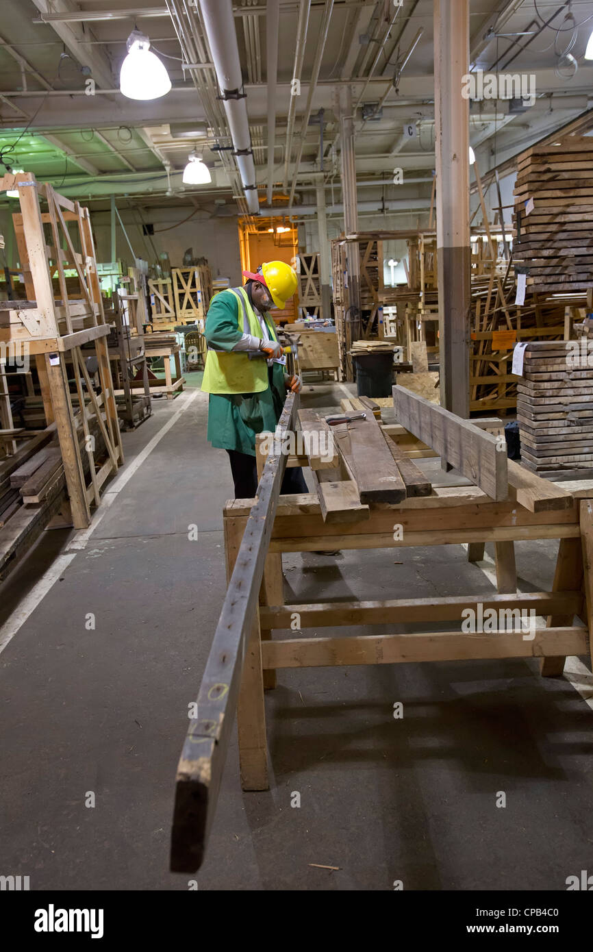 Workers Recycle Building Materials Salvaged from Deconstruction of a ...
