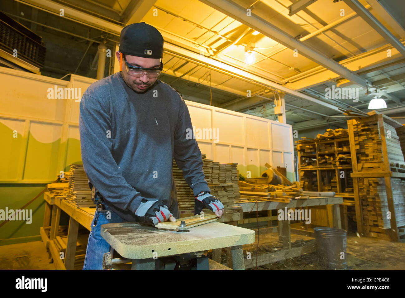 Workers Recycle Building Materials Salvaged from Deconstruction of a ...