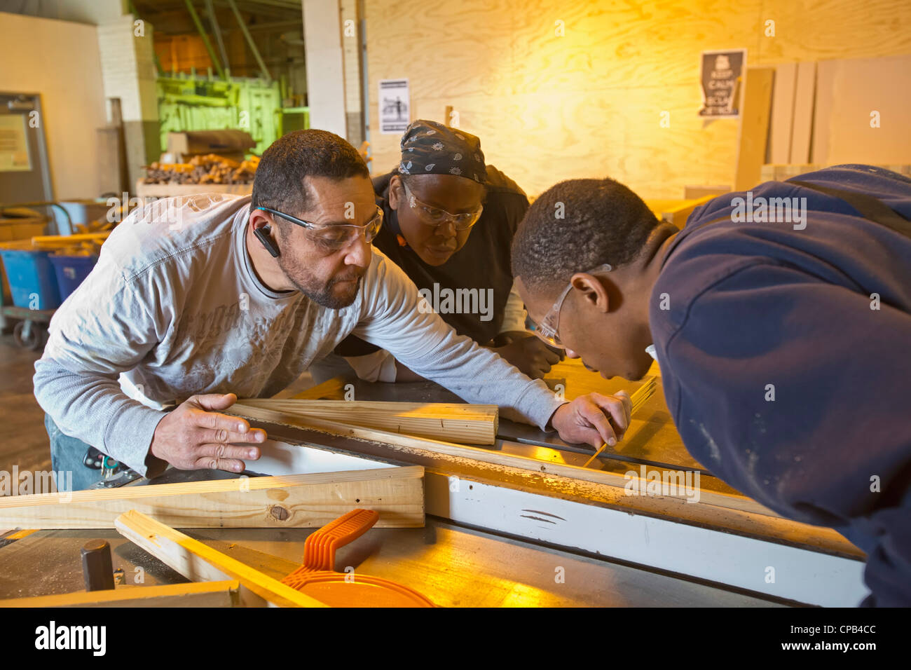 Workers Recycle Building Materials Salvaged from Deconstruction of a ...