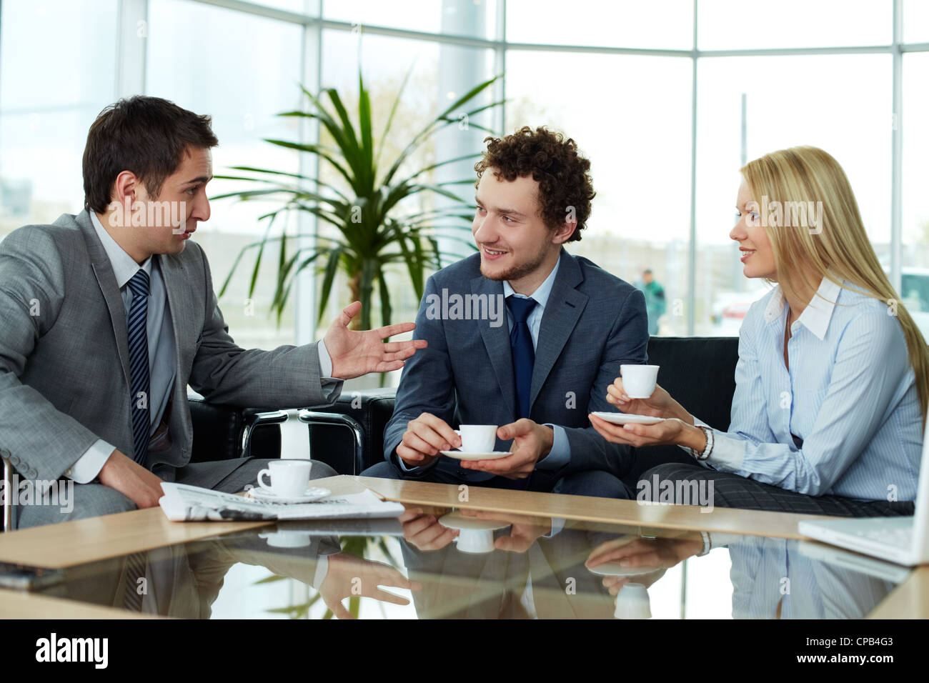 Business team sharing ideas during break Stock Photo - Alamy