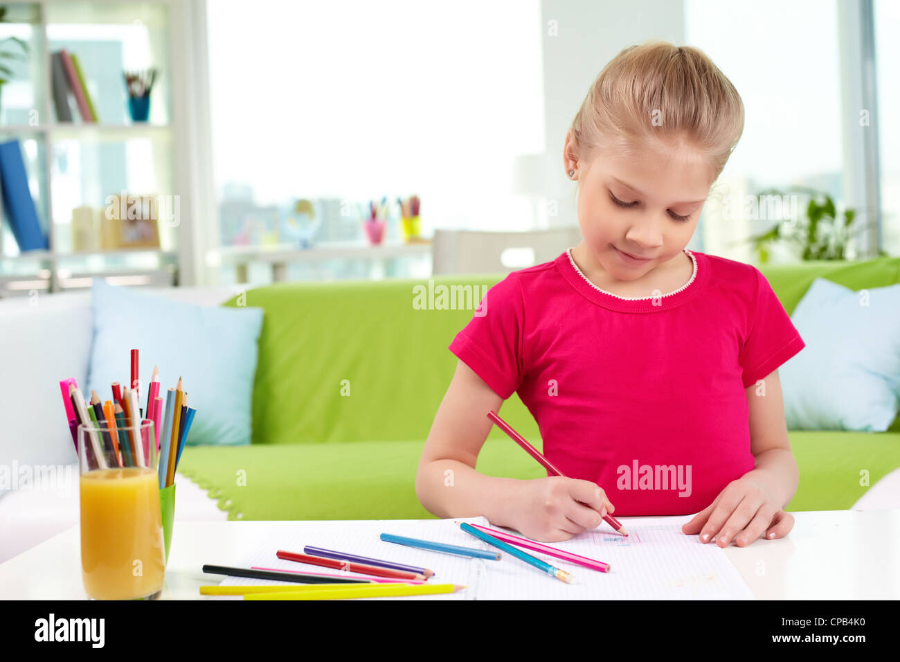 Portrait of lovely girl drawing with colorful pencils Stock Photo - Alamy
