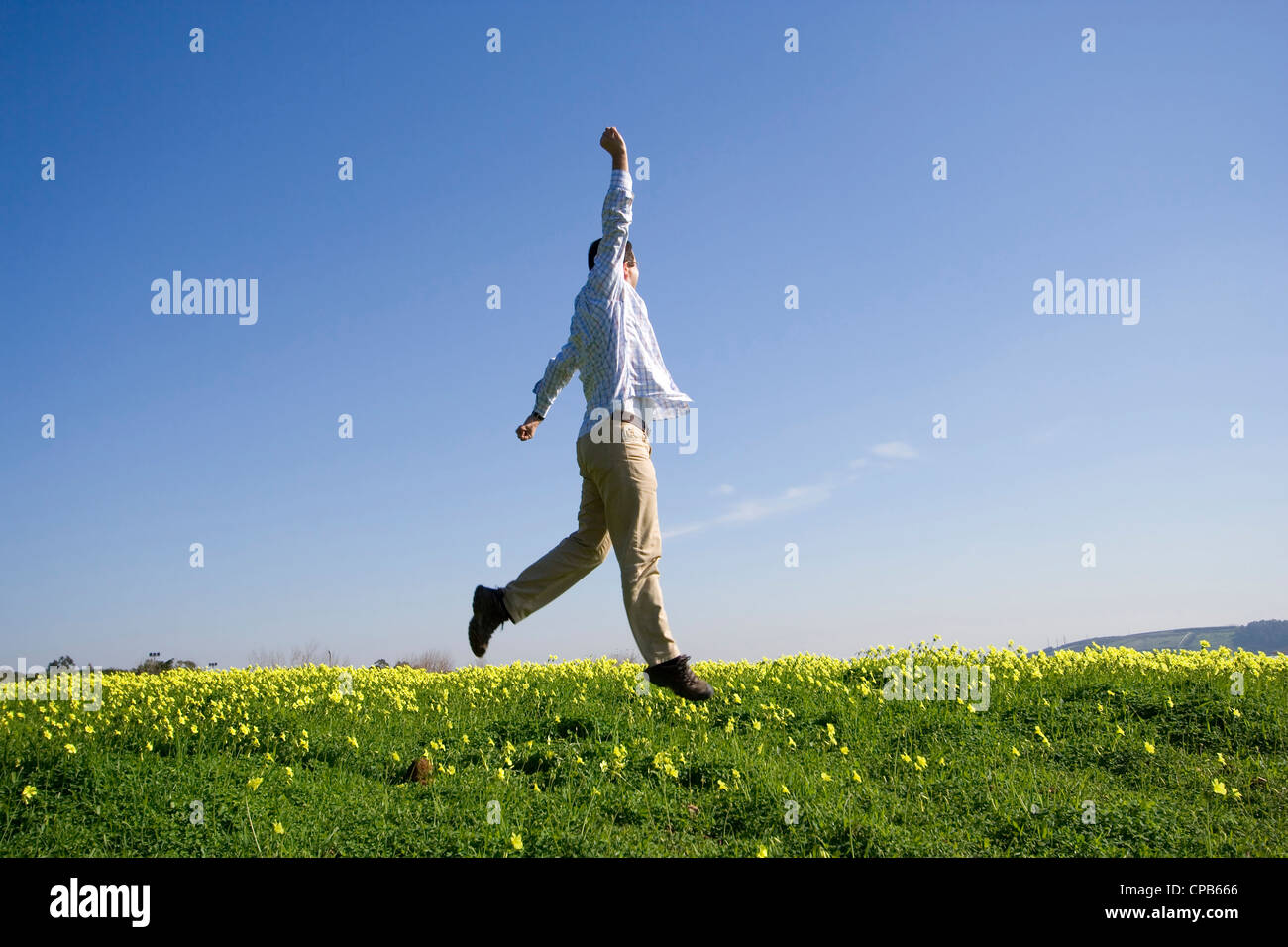 a young man jumping high to success Stock Photo - Alamy