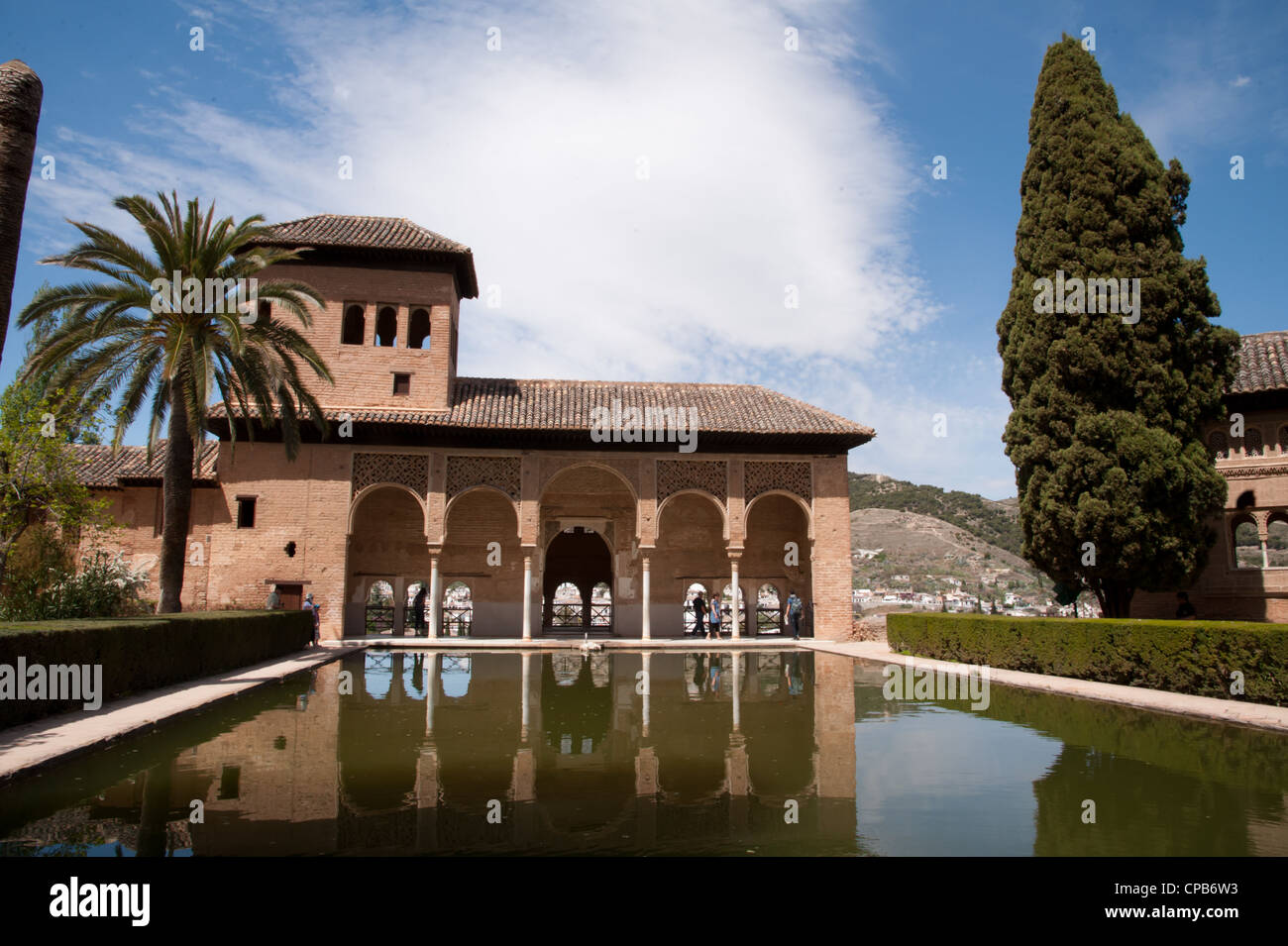 The Partal Palace is reflected in a pool in the Alhambra in Granada ...