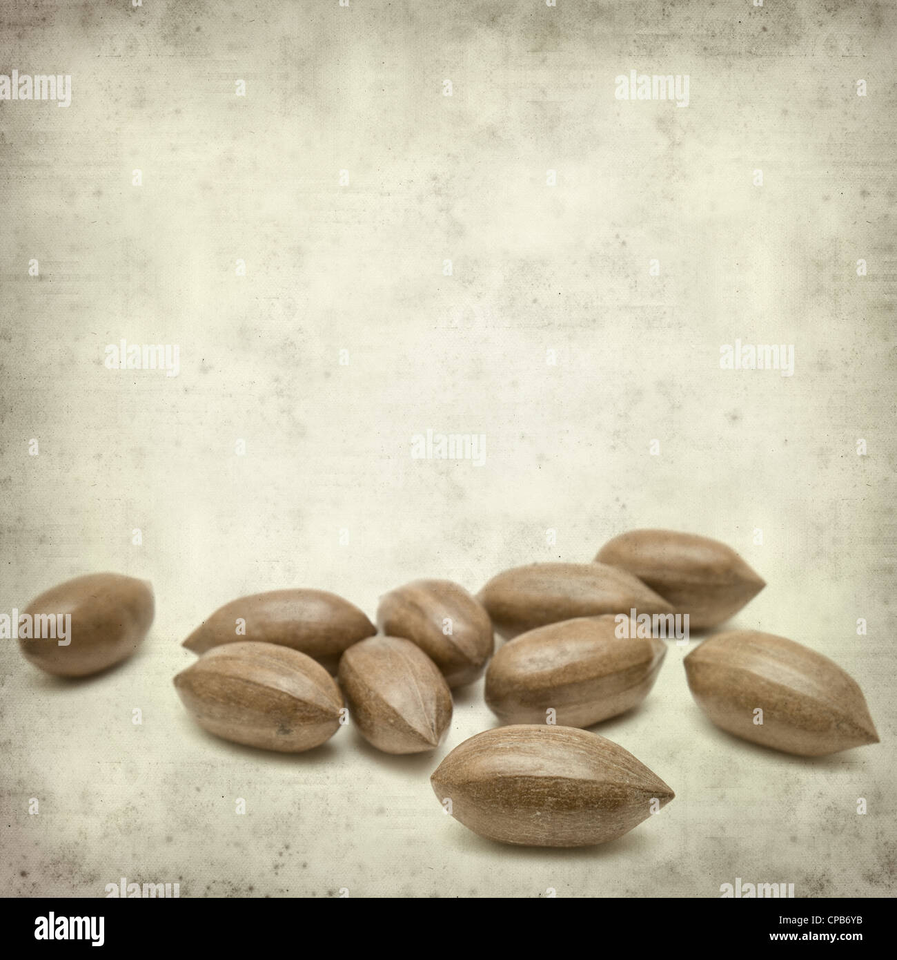 textured old paper background with shiny ripe pecan nuts Stock Photo ...