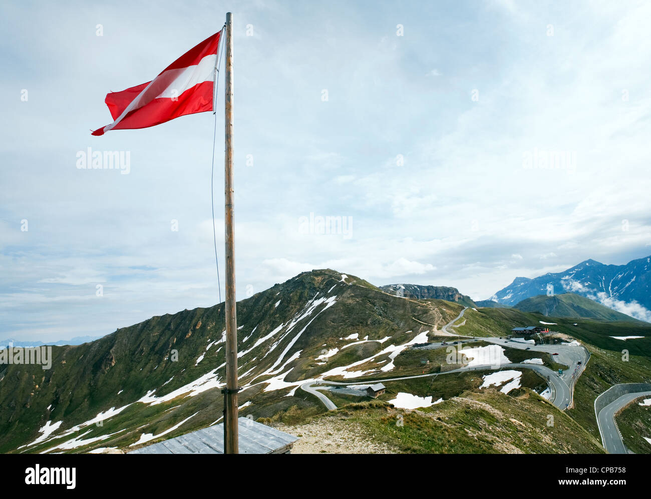 Tranquil summer Alps mountain and Austrian Flag above Grossglockner ...