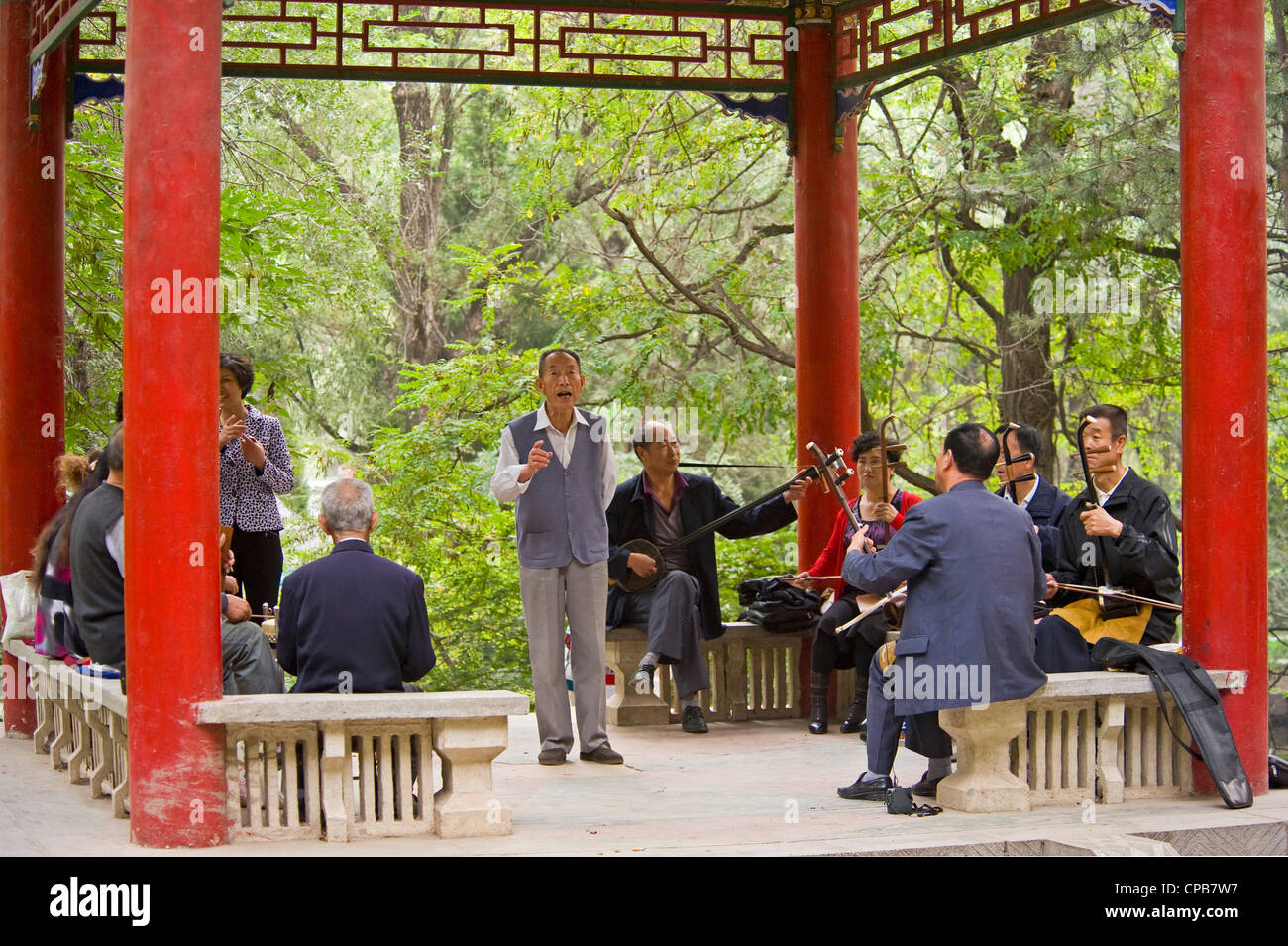 A Chinese group/band of musicians play traditional Chinese music (Erhu ...