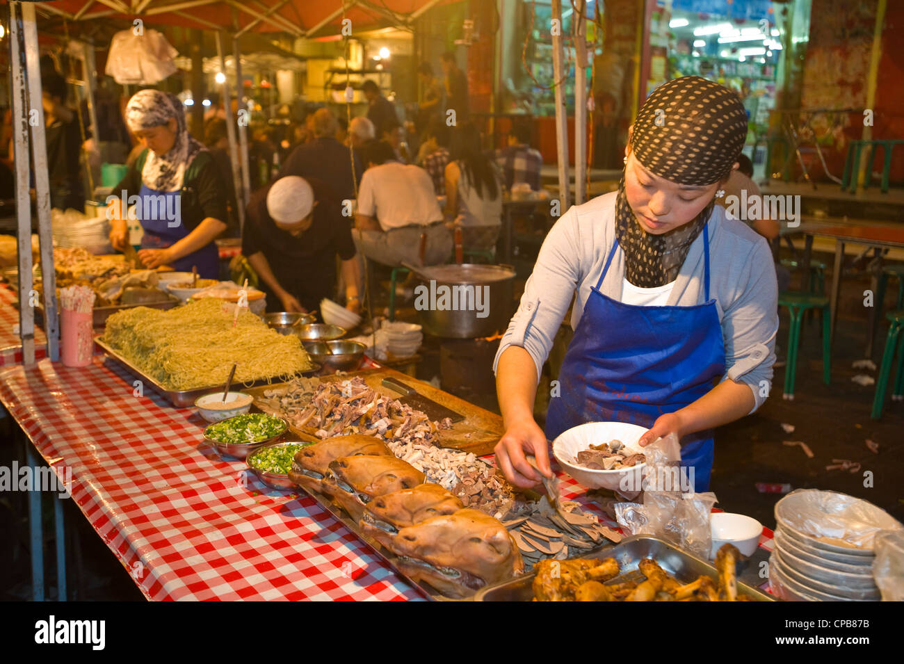 Preparing sheep head and stomach snack food at the well known Zhengning ...