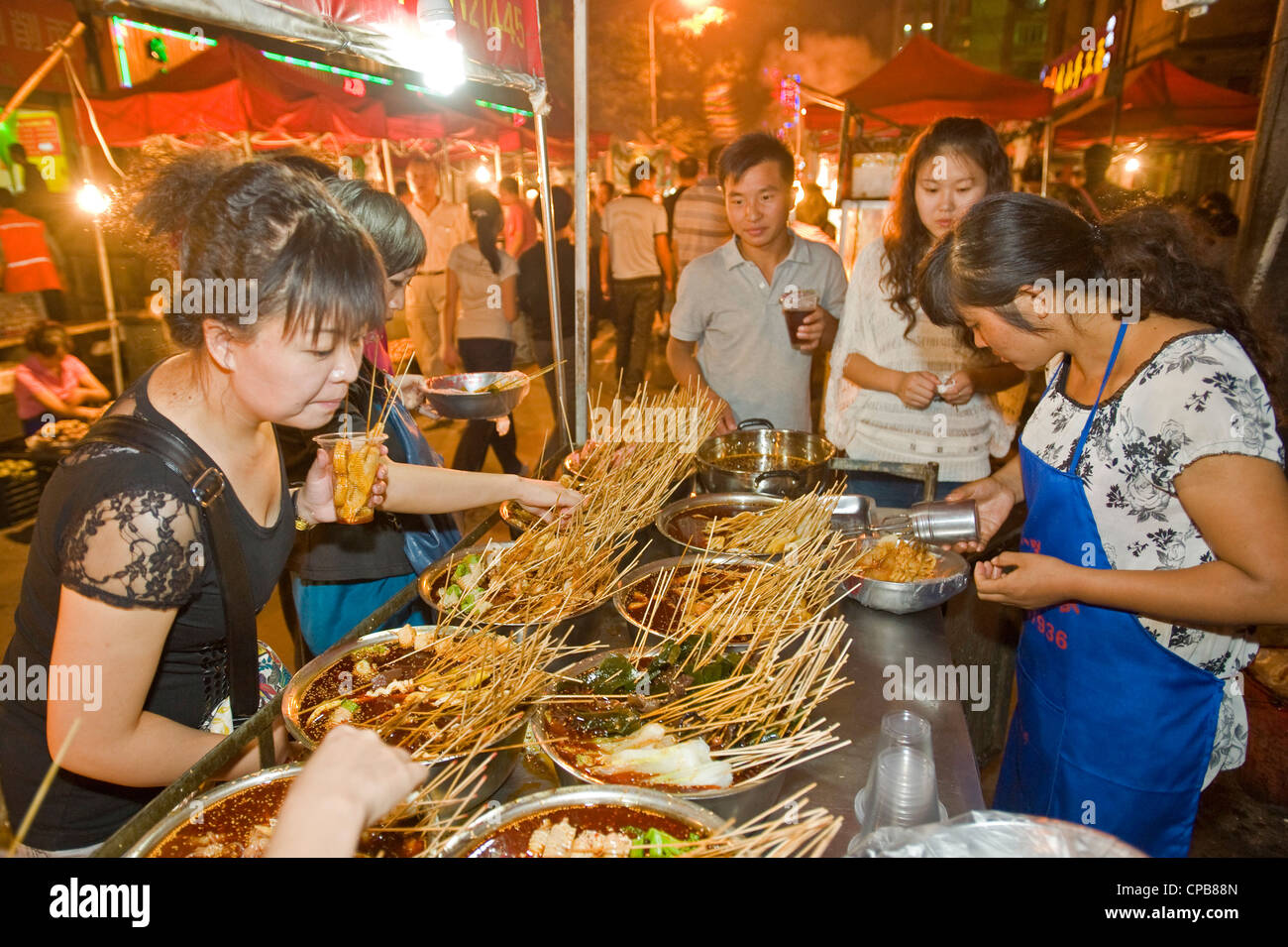 Selling snack food at the well known Zhengning Road night food street ...