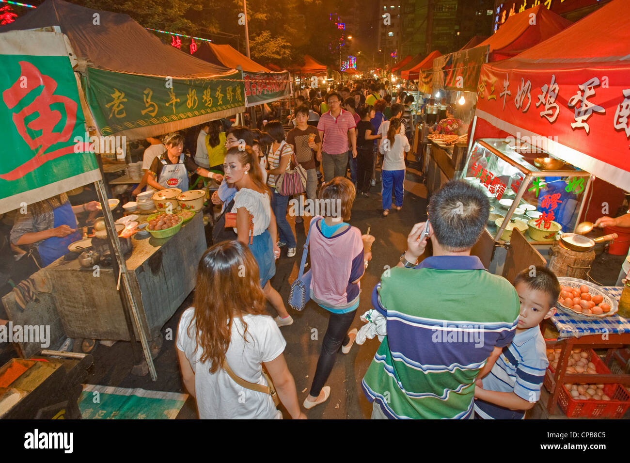 A view of people walking along the well known Zhengning Road night food ...