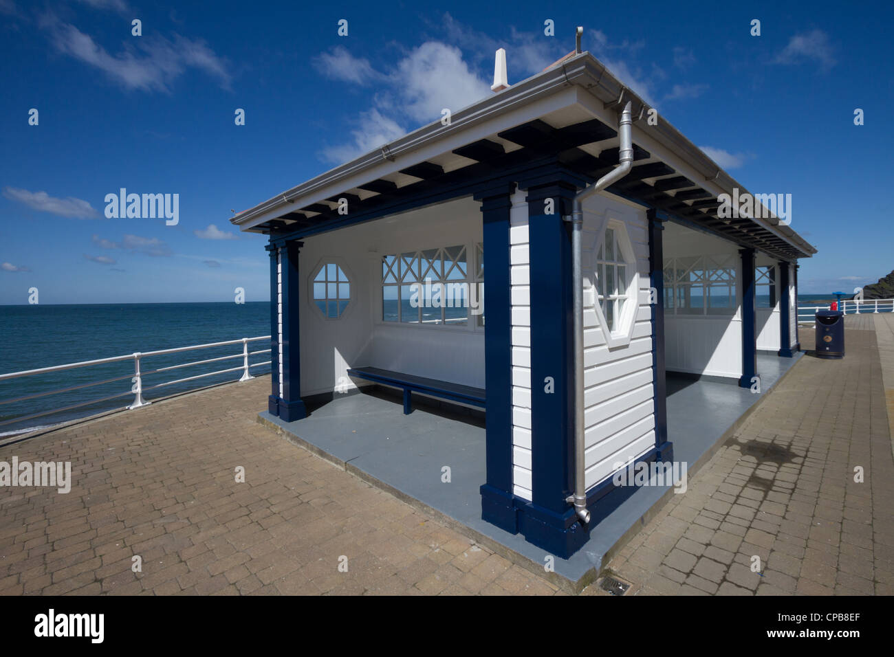 Edwardian seaside promenade shelter with sea and sky in background ...
