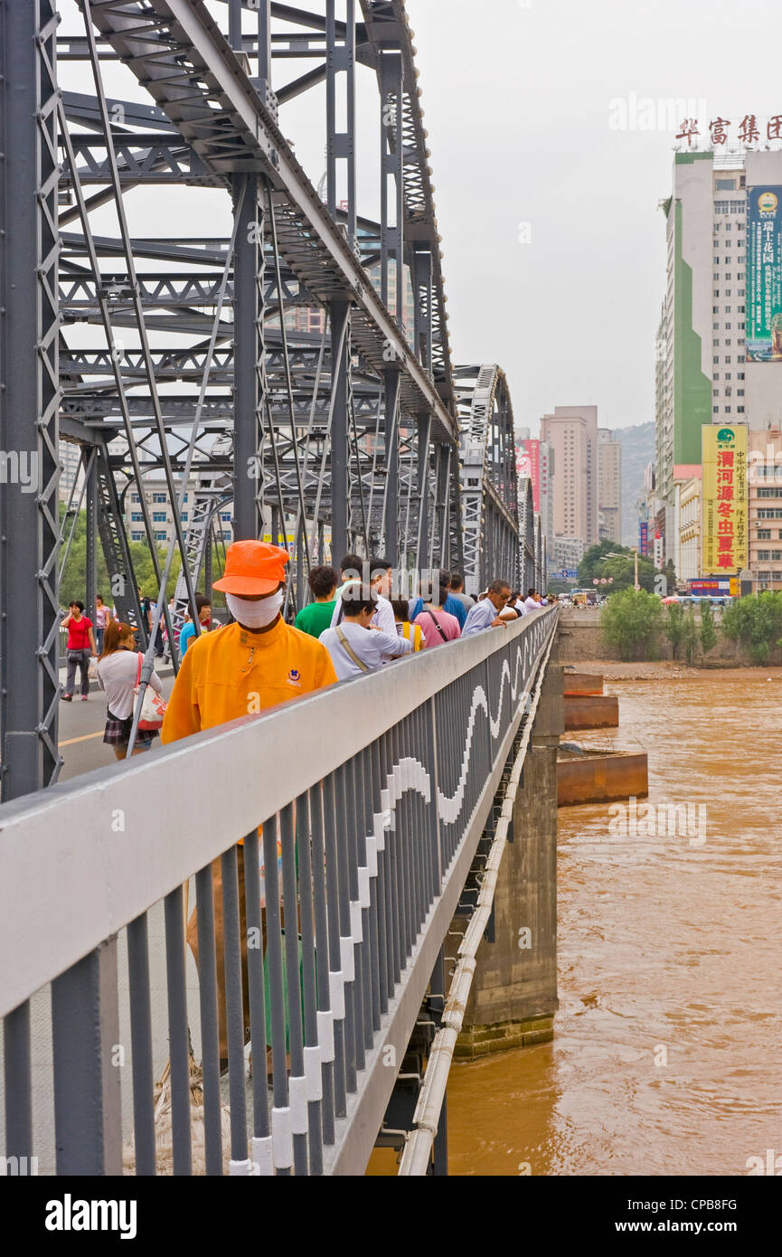 A view across the Yellow River in Lanzhou with the Zhongshan Bridge on ...